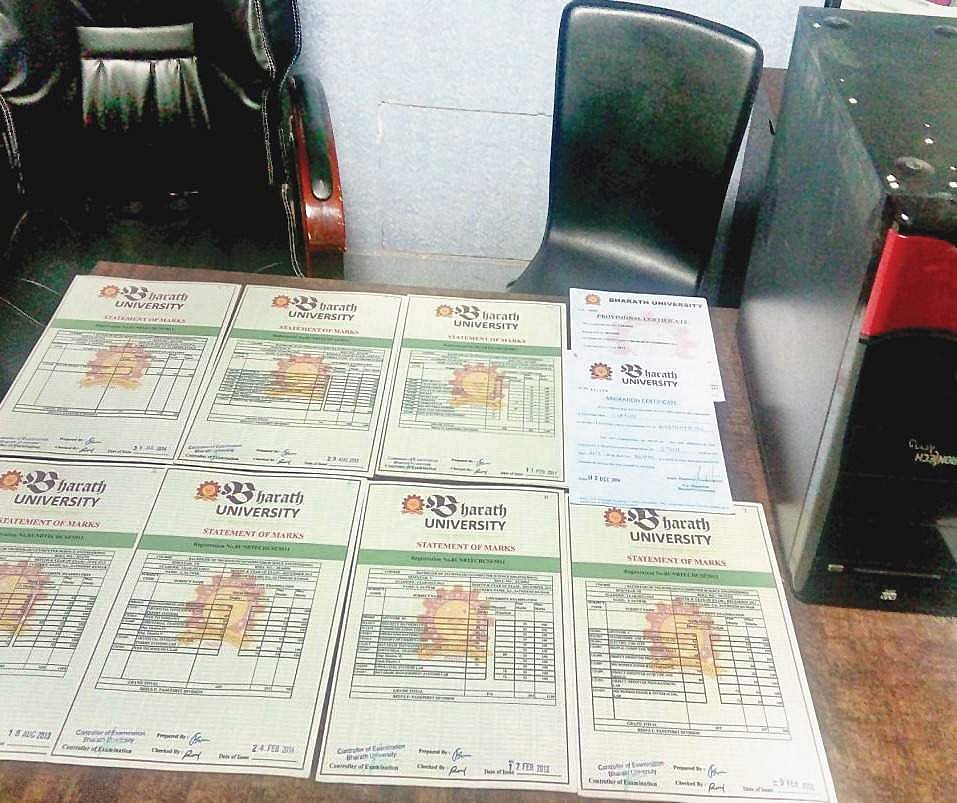 Man held for issuing fake marks cards