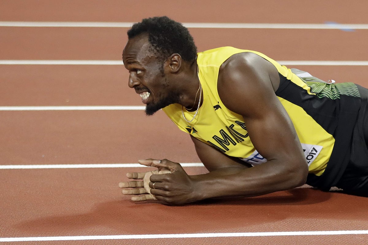 Sad farewell for injured Usain Bolt as Britain win 4x100m relay at IAAF ...