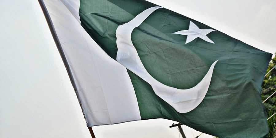 Activist brings down Pakistani flags in PoK region's Dadyal