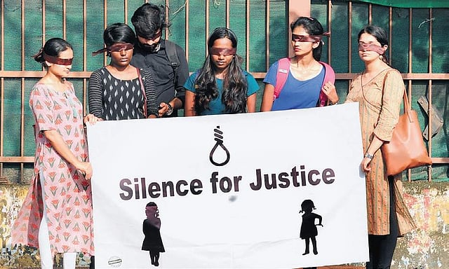 Feminist group holds silent protest seeking justice