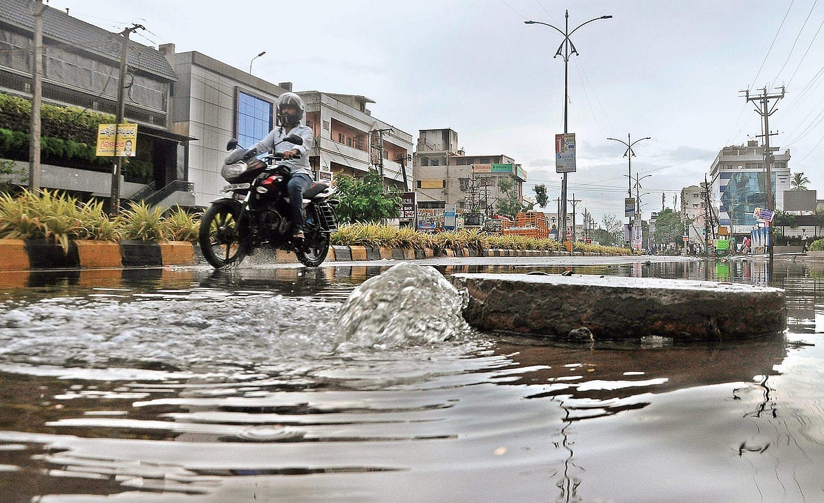 Manholes overflow, roads inundated as rain bares poor city civic ...