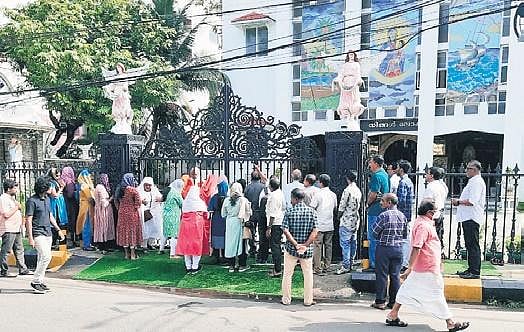 Faithful attend Mass standing on road outside St Mary’s Cathedral Basilica