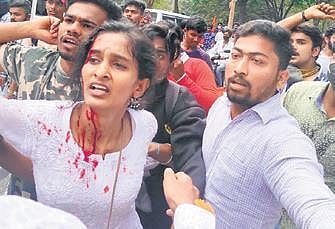 Police cane protesting students at Bangalore University campus