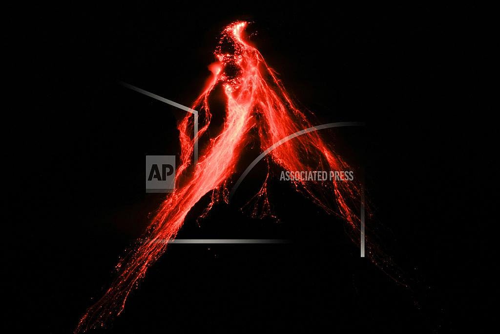 Philippines' Mayon volcano spews lava down its slopes in gentle ...