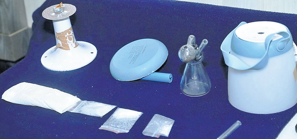 Ganja, gun and 6 bullets seized, Two held