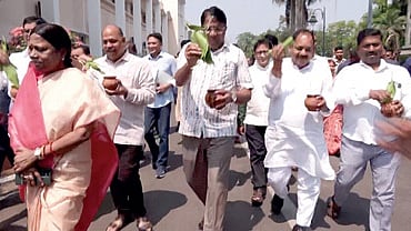 Protesting entry of cops, BJD MLAs sprinkle ‘Ganga Jal’ to purify Assembly