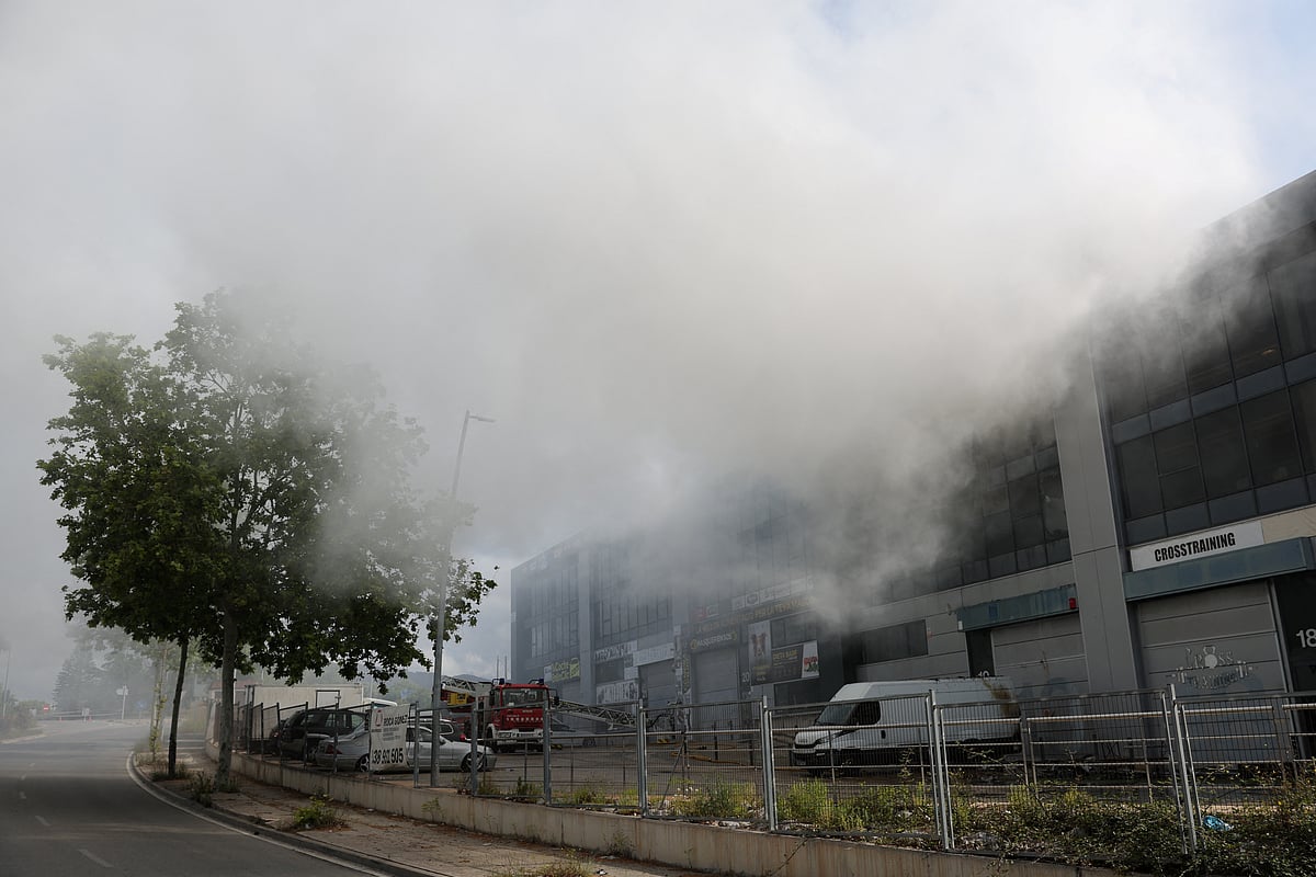 Thousands confined indoors after fire at industrial warehouse release ...