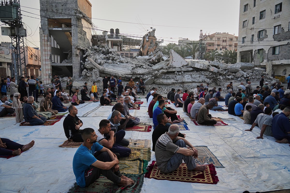 Gaza marks start of Eid with outdoor prayers amongst rubble
