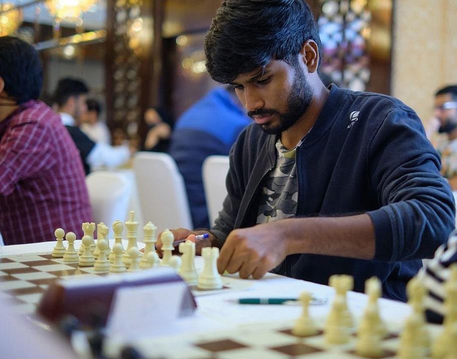 This coach is taking chess champs head-on