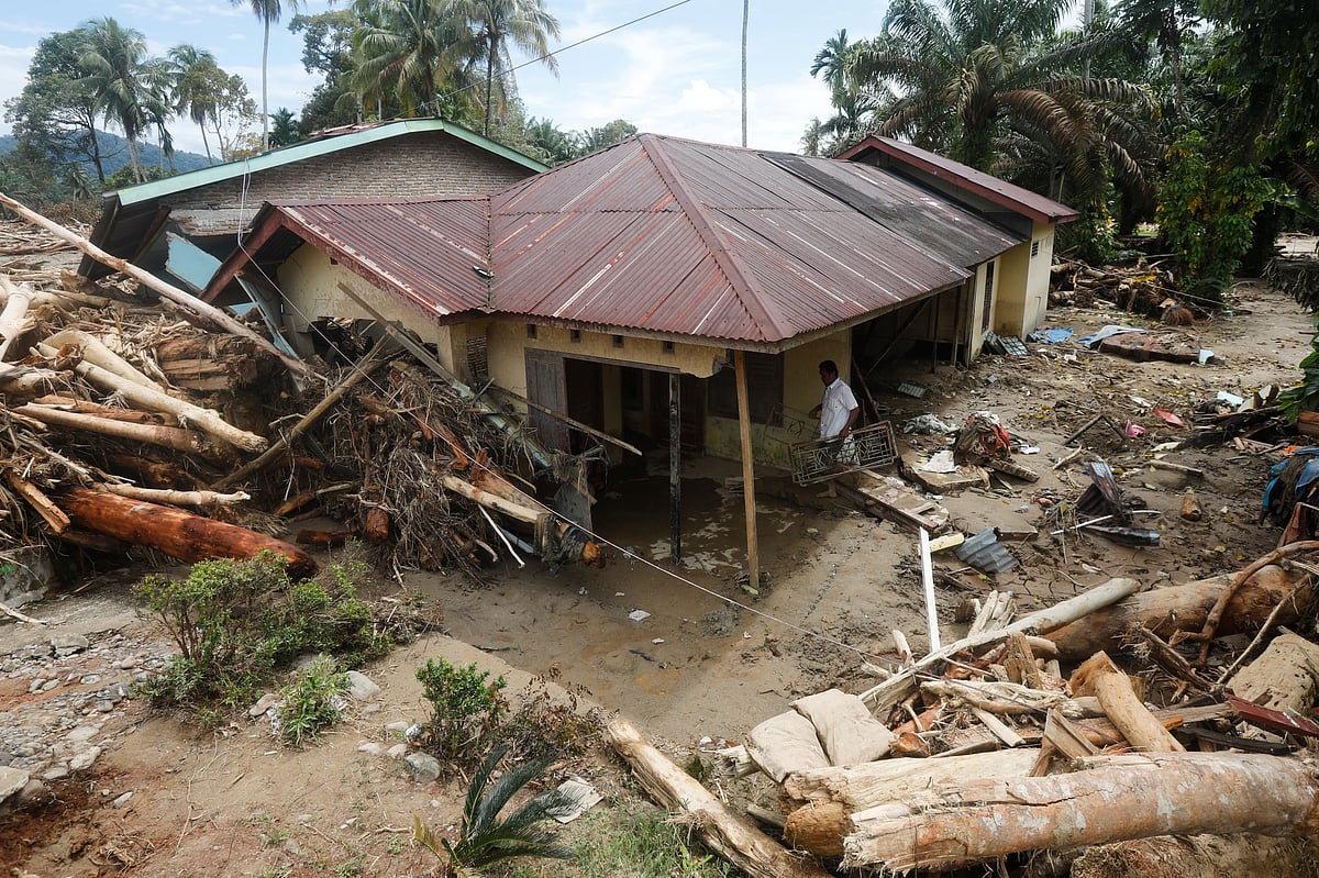 Deadly Asian floods no fluke but climate warning, scientists say